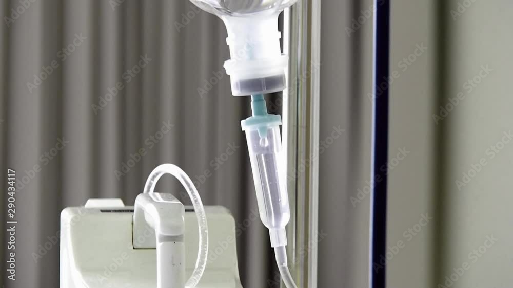 close up intravenous saline solution drop drip for treatment. Focus ...