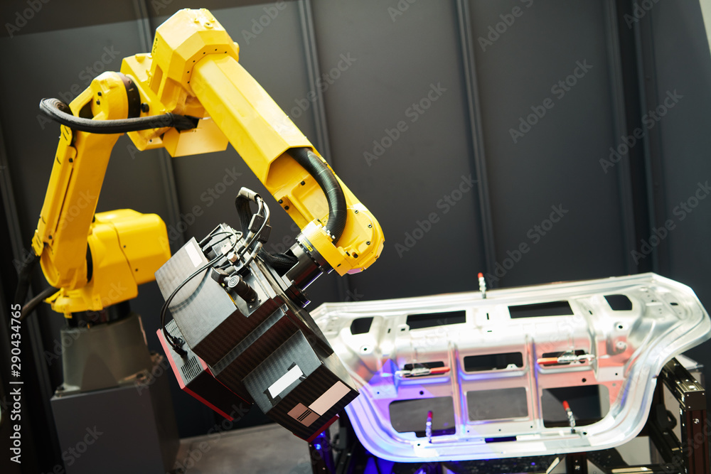 Robotic industry. Robot with 3D sensor scanner measures surface of ...