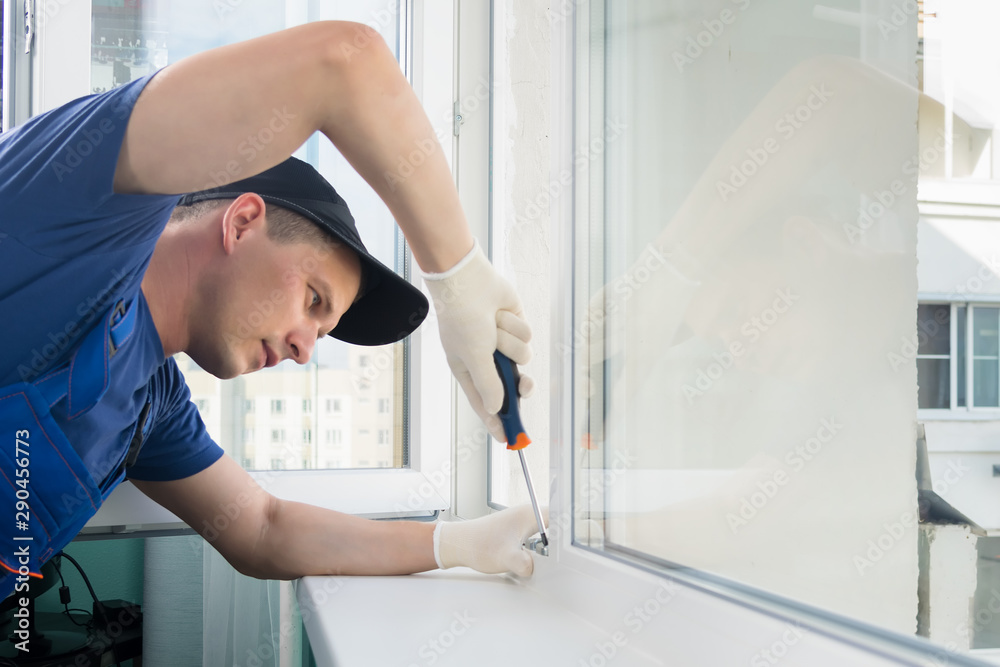 window installation wizard configures window closing Stock Photo ...