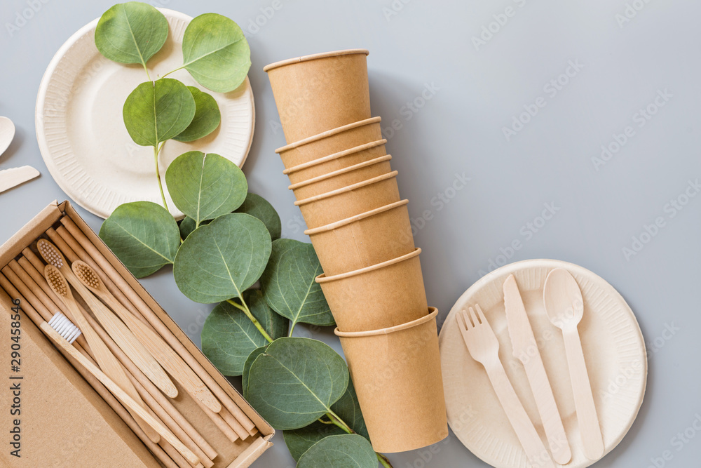 eco natural paper cups, straws, wooden cutlery flat lay on gray ...