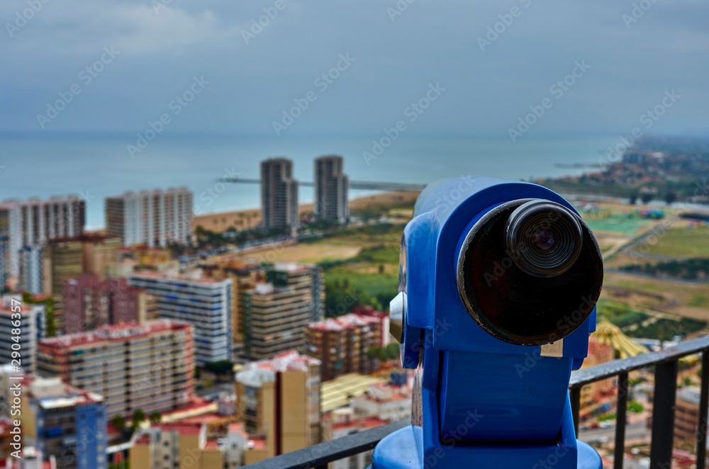 Coin operated binocular tower viewer on observation deck with view on ...