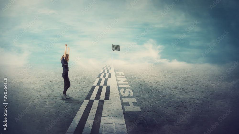 Side view of competitive girl confident crossing the finish line ...