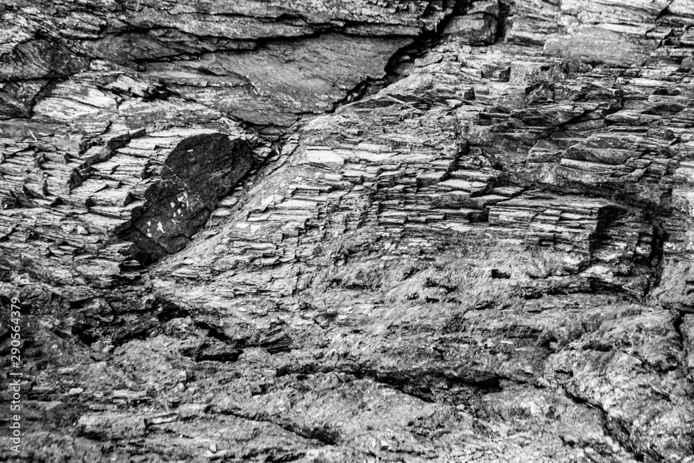 Stratified layers of rocks and rock pools on the edge of the River Tavy ...