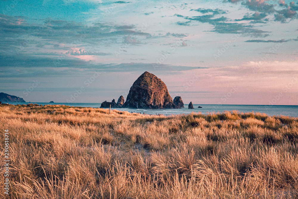 Cannon Beach, Oregon coast: the famous Haystack Rock in the golden ...