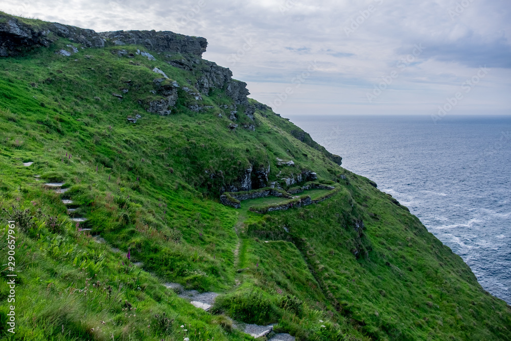 A ruins of old castle on the cliff edge that overlooked the sea is now ...