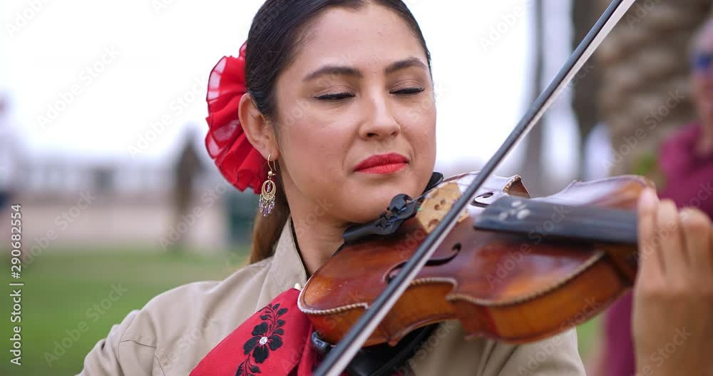 Stockvideon Hispanic Mexican mariachi latino woman musician plays ...
