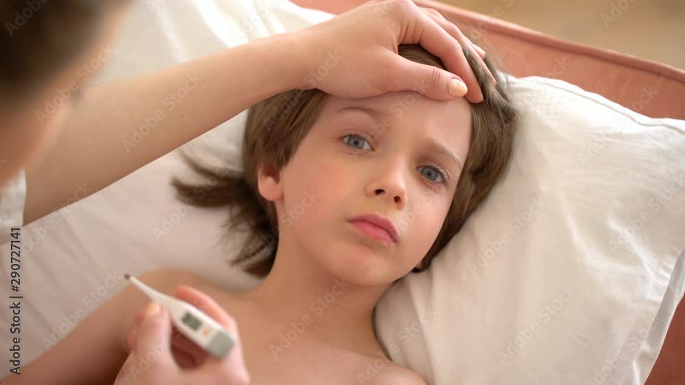 cold flu virus disease, sick kid in bed with thermometer. Sick baby ...