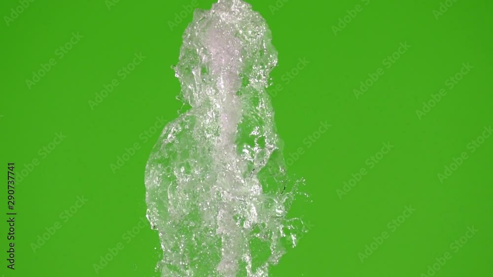 Water jet on a green background. Green screen. Splashes and drops of ...