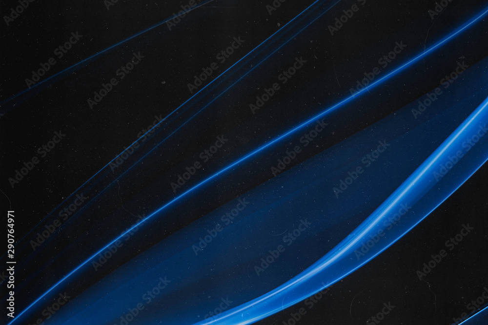 A real wisp of blue smoke on a black background with grain, dust and ...