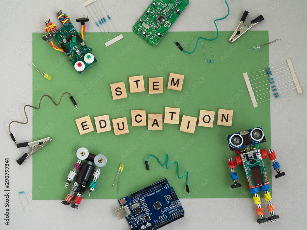 STEM school concept. A metal robot and an electronic board that can be ...