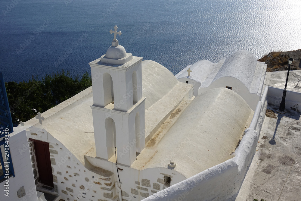 Picturesque small chapels below iconic castle of Astypalaia island with ...