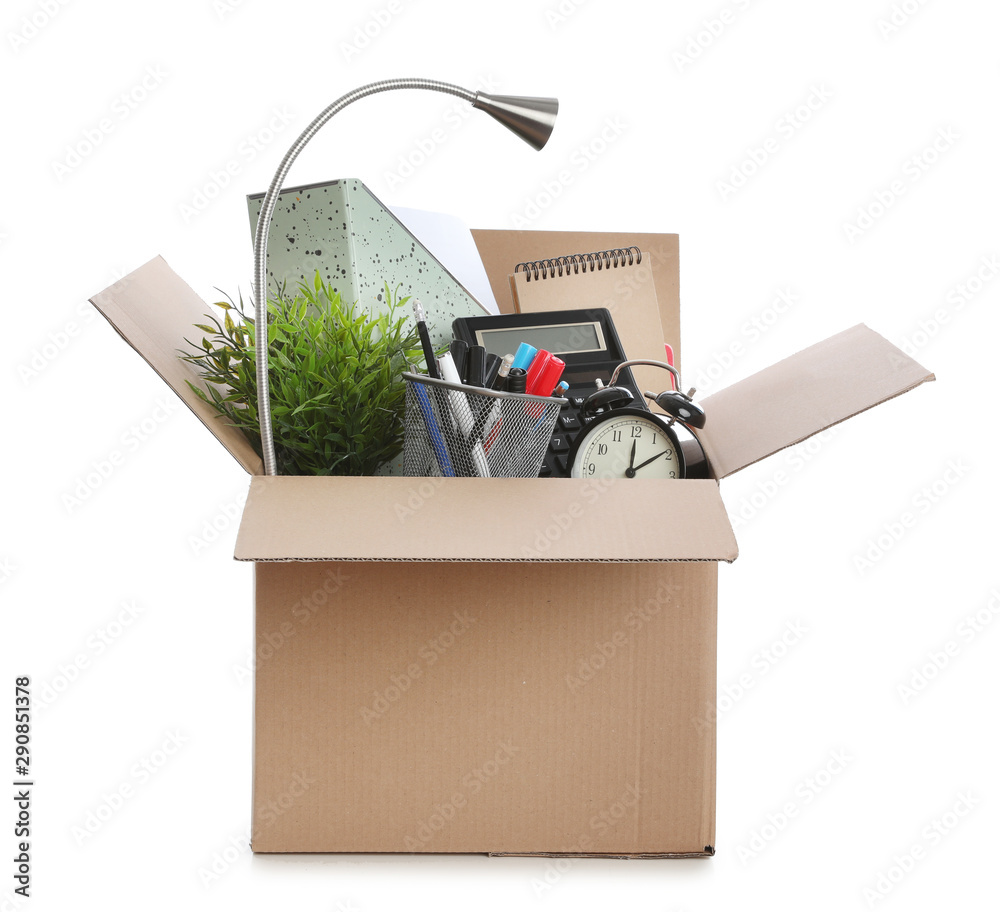Cardboard box full of office stuff on white background Stock Photo ...