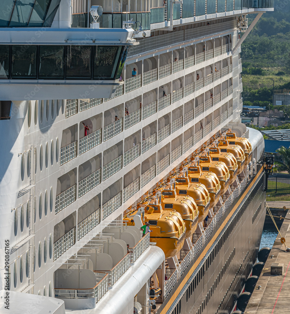 Side perspective of cruise ship with lifeboats from high vantage point ...