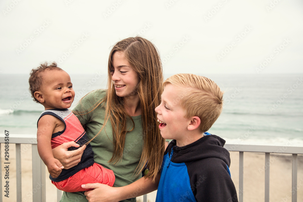 Diverse group of children laughing together and playing together ...