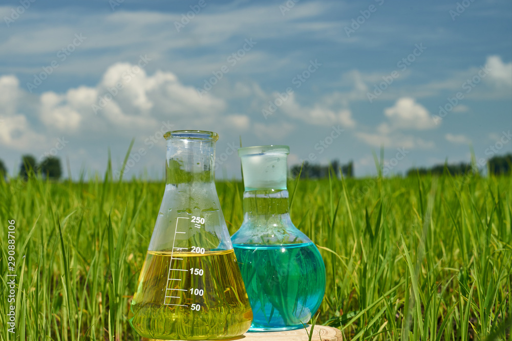 Image of a glass flask with a chemical solution on the background of ...