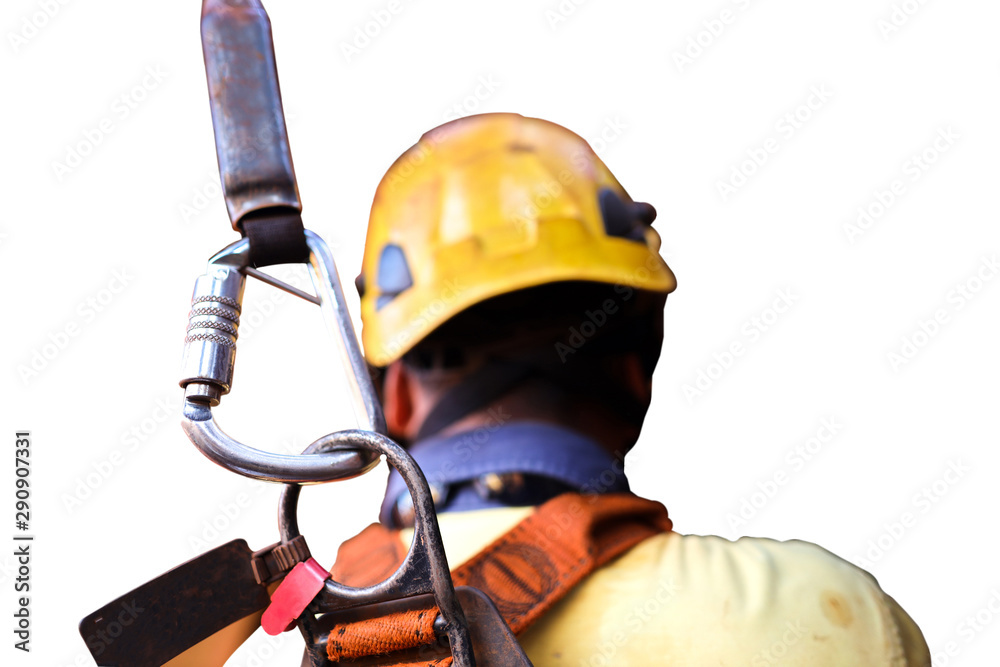 Construction worker welder wearing safety helmet, fall arrest harness ...