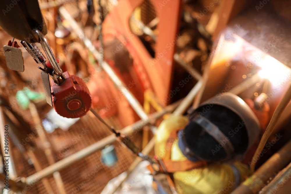 Top view welder wearing safety helmet fall arrest harness using fall ...