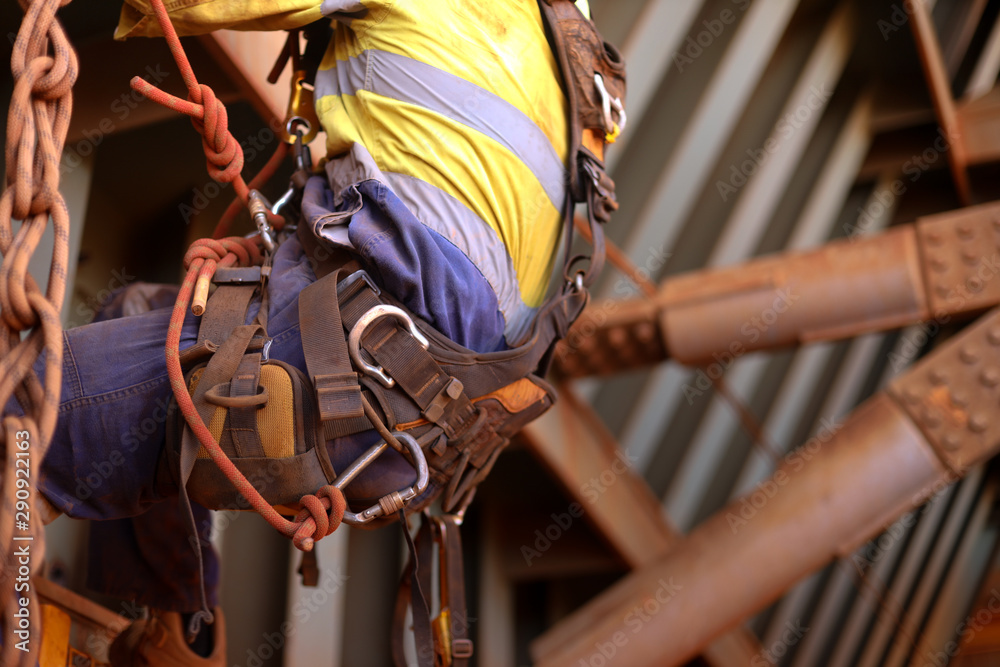 Closeup picture of male rope access inspector worker wearing full ...