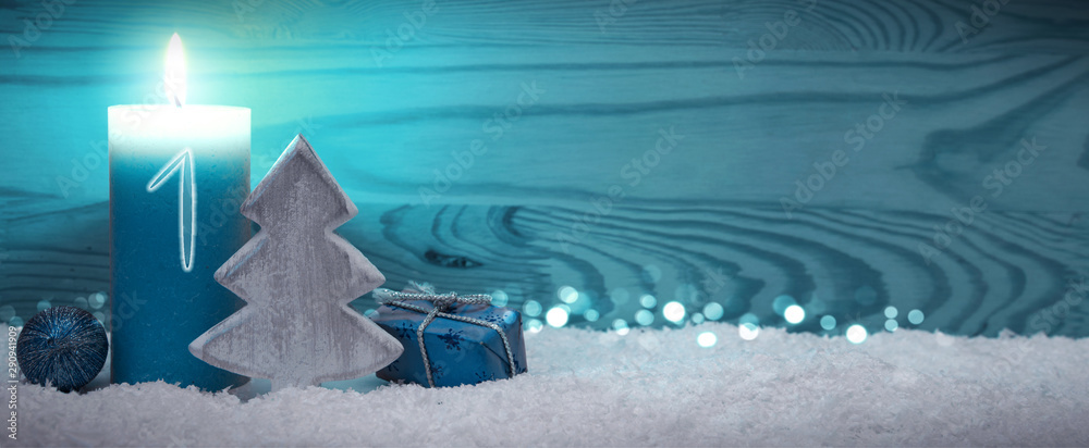 First Advent.Christmas background with Advent candle and blue ...