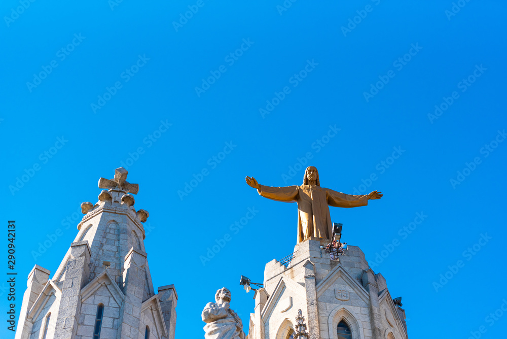 Golden Statue of Jesus Christ on the facade of the Temple of the Sacred ...