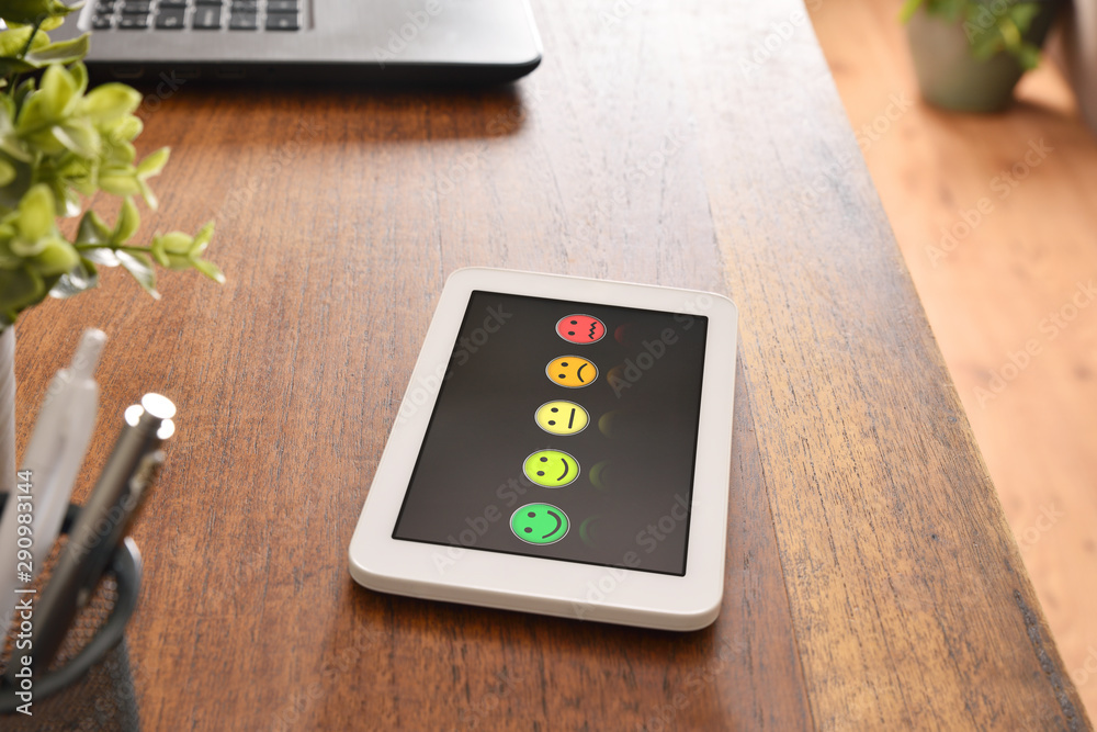 Device representing emoticons to assess satisfaction in desk Stock ...