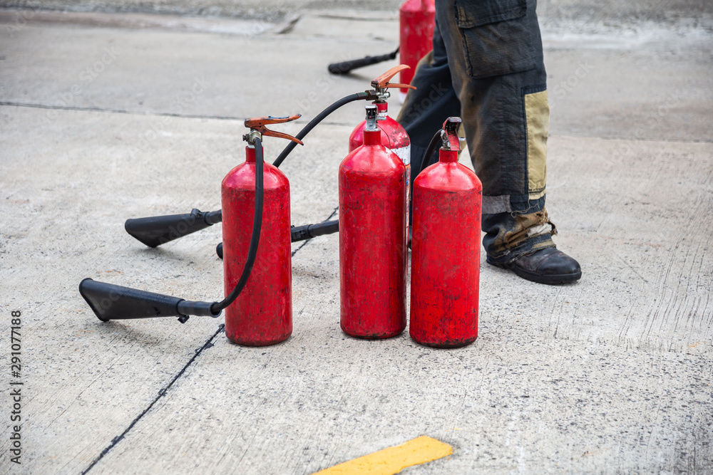 Firemen using extinguisher and water for fight fire during firefight ...