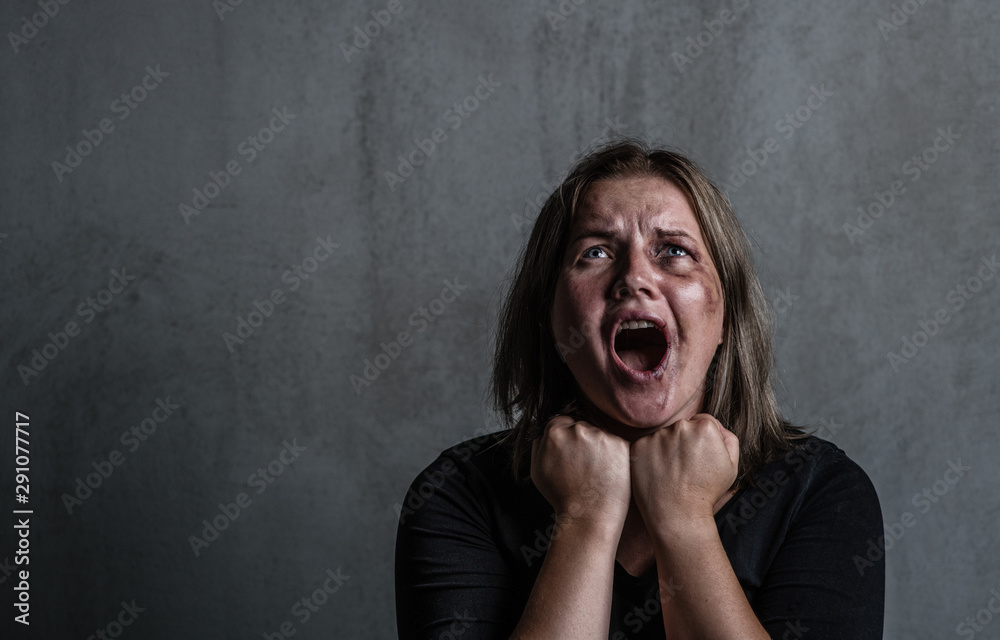 Angry young woman victim of domestic violence and abuse having nervous ...