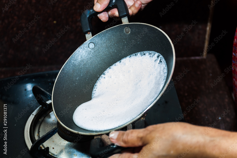 Preparation of Paalappam, Kerala's dish, in a appa chatti, nonstick pan ...