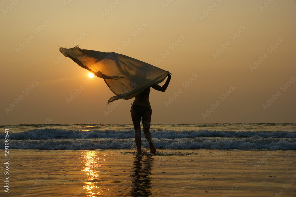 Beautiful girl dancing alone on the beach Stock Photo | Adobe Stock