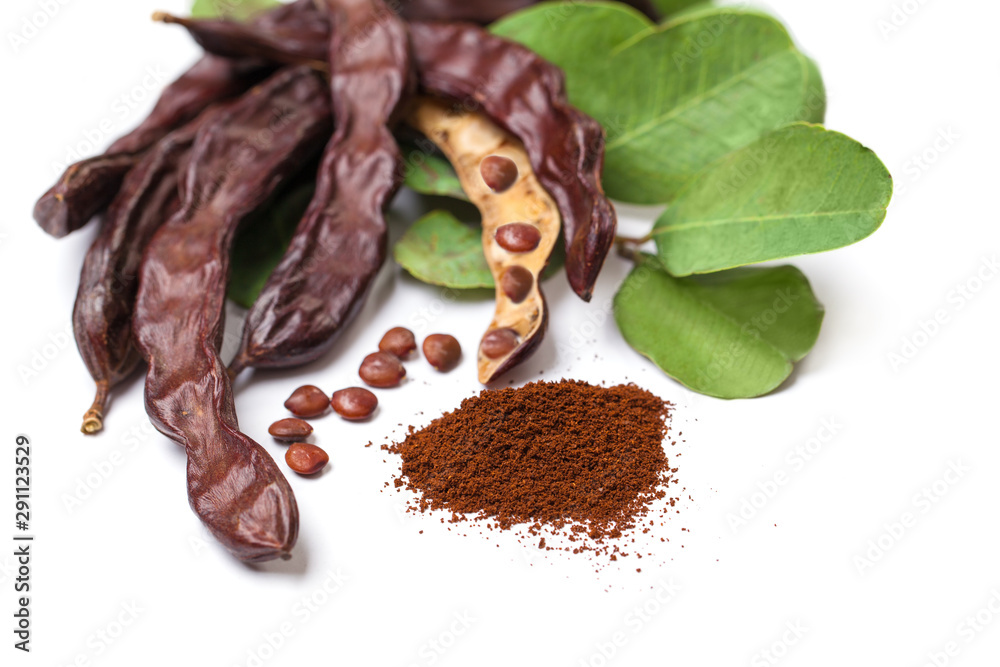 Carob beans. Healthy organic sweet carob pods with seeds and leaves and ...