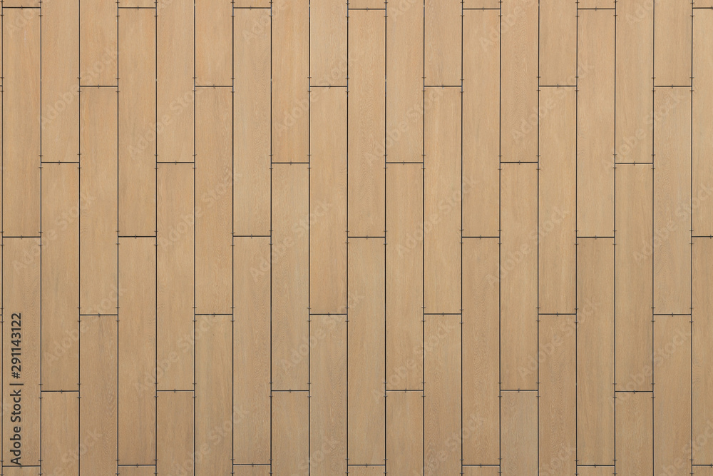 Long vertical beige tile laid in rows. Just laid wall or floor ceramics ...