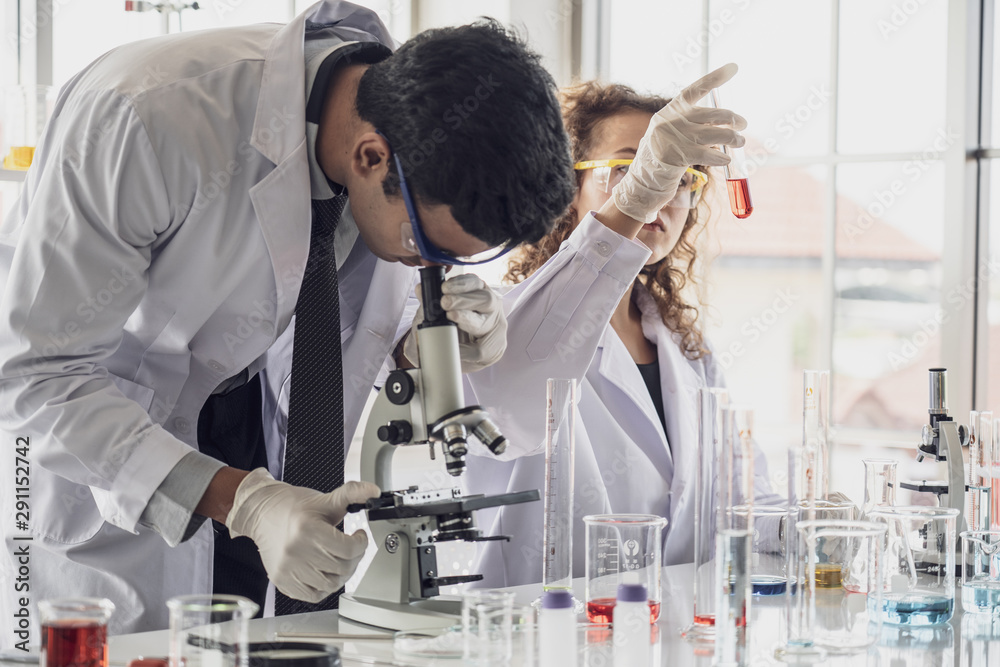 Team of Medical Research Scientist Conducts Experiments in Laboratory ...