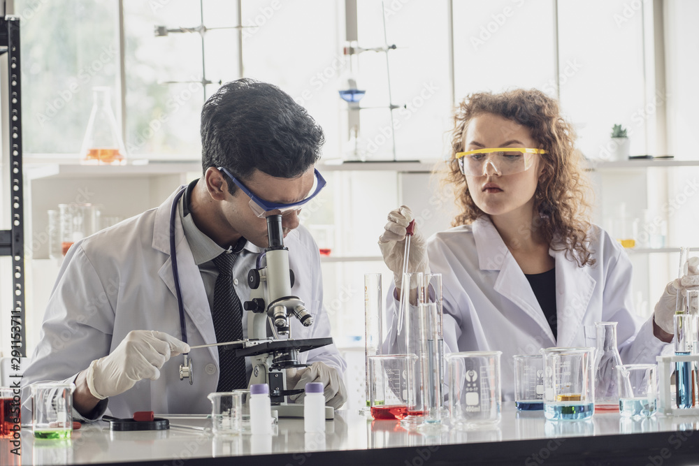 Team of Medical Research Scientist Conducts Experiments in Laboratory ...