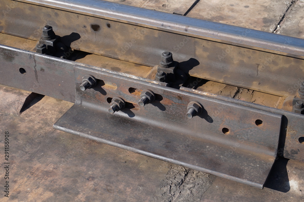 Rail connections and fittings: rails, bolts, railway sleepers Stock ...