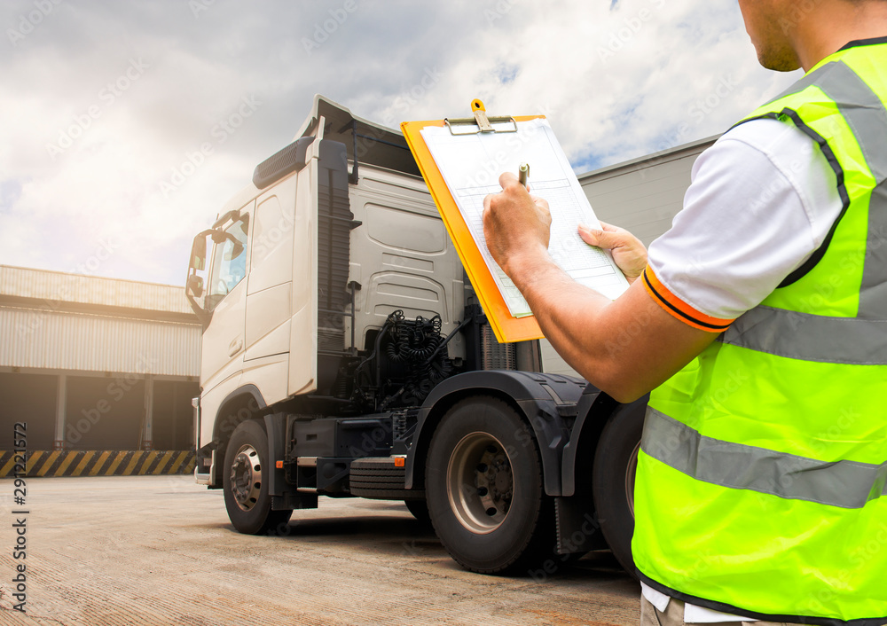 Truck Driver is Checking the Semi Truck's Engine Maintenance Checklist ...