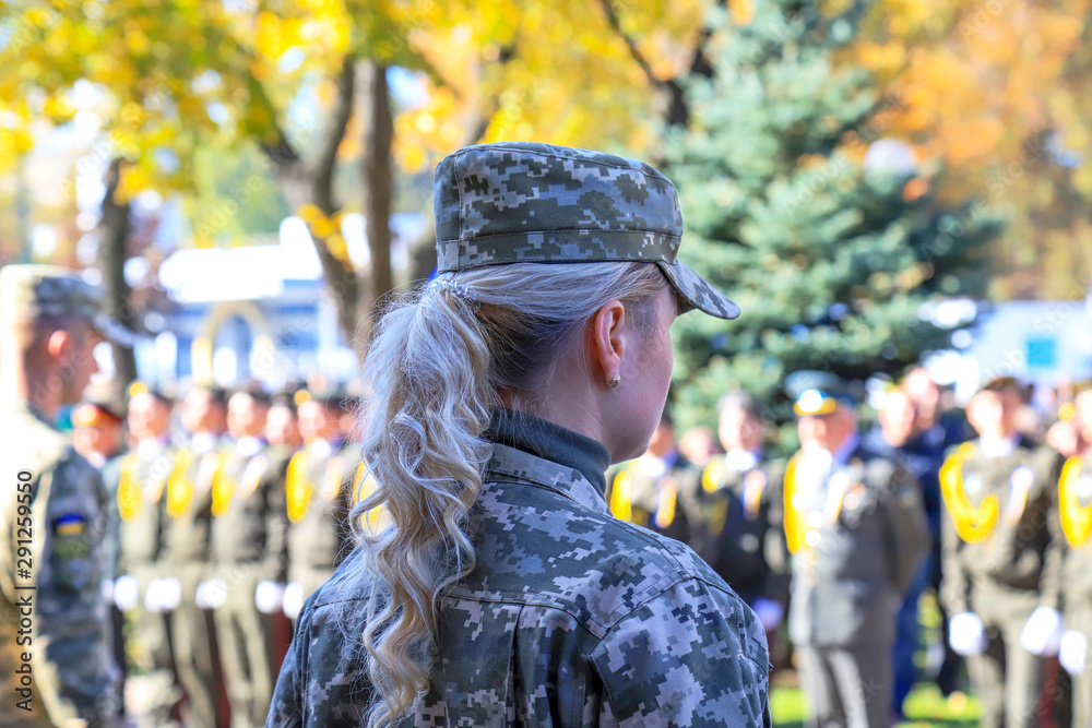 Girl soldier of the Ukrainian army is standing in the parade. Defender ...
