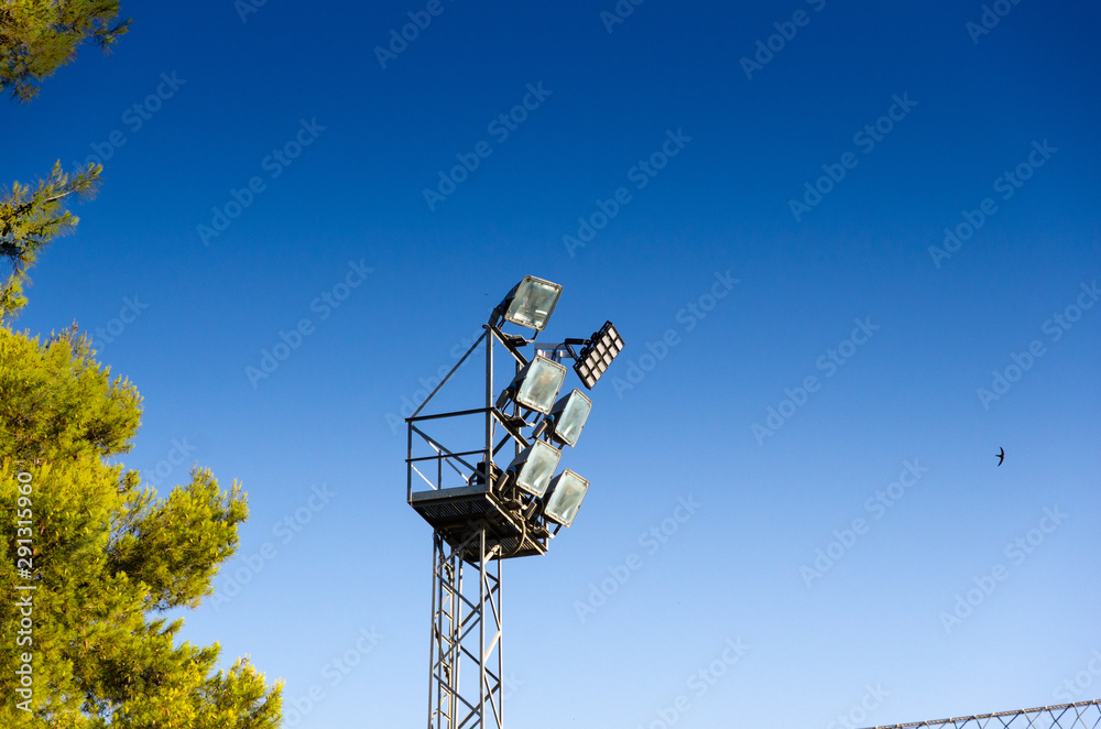 Halogen and LED lighting at the sports football stadium. The lights are ...