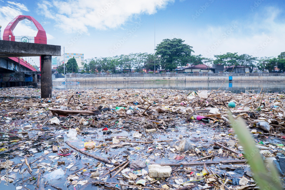 Dirty river with heap garbage floating the water Stock Photo | Adobe Stock