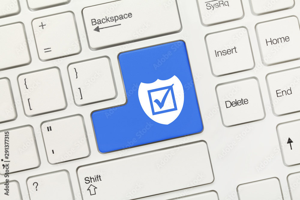 White conceptual keyboard - Blue key with shield and checkbox symbol ...