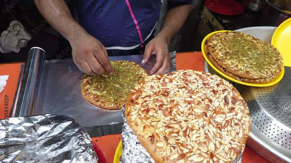 Street vendor selling almond topped Shahi Sheermal or Shirmal, is a ...