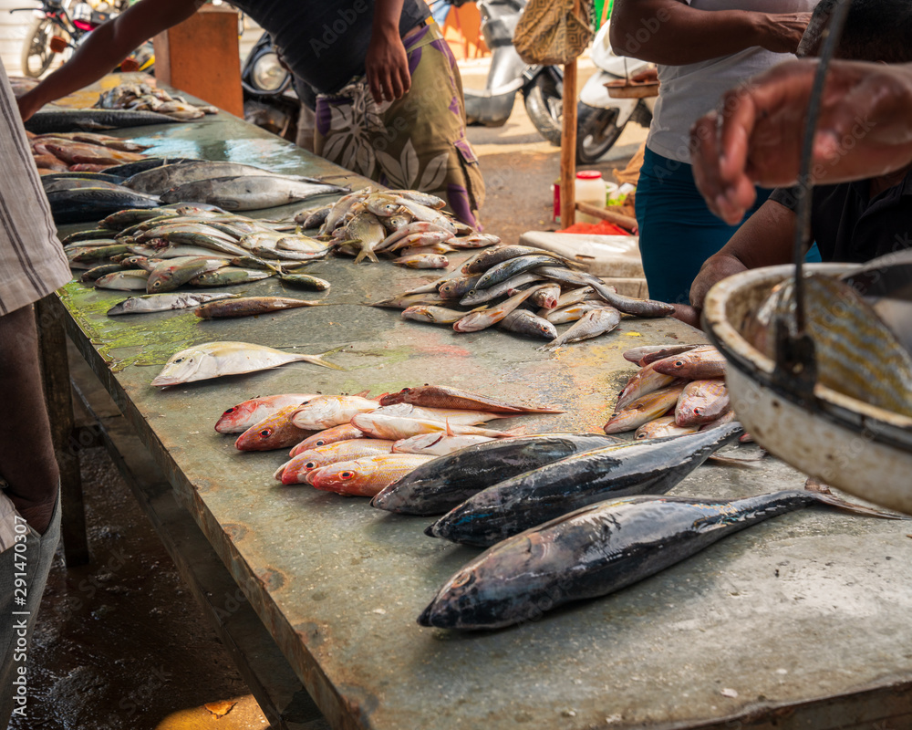 retail sale of fish on the dirty counter at the fish market, around ...
