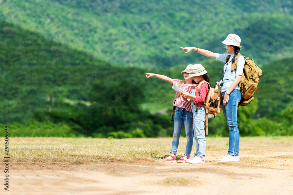 Group asian family children checking map and pointing in the jungle ...