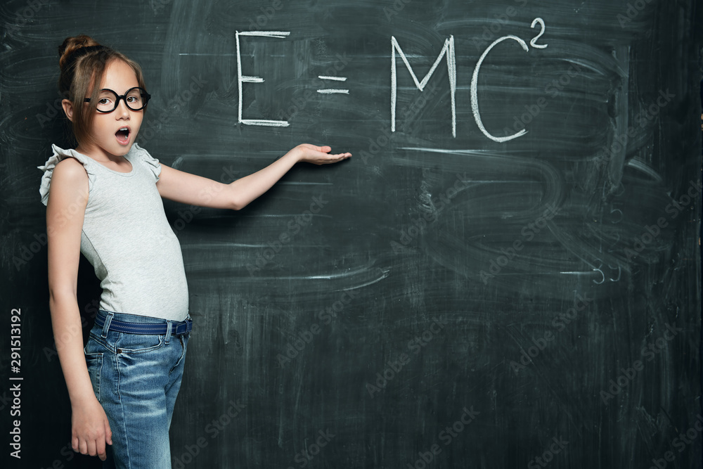 schoolgirl near blackboard Stock Photo | Adobe Stock