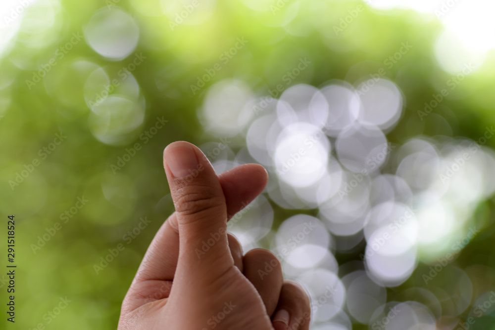 Hand-shaped heart symbol, i love you hand sign on nature light bokeh ...