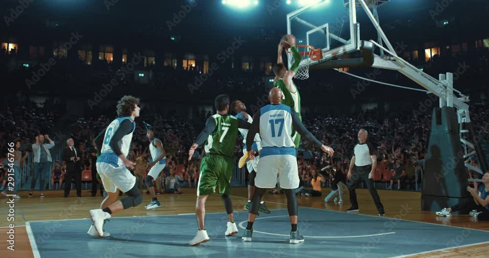 Basketball players on big professional arena during the game. Tense ...