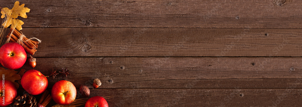 Autumn corner border banner of apples and fall ingredients on a rustic ...