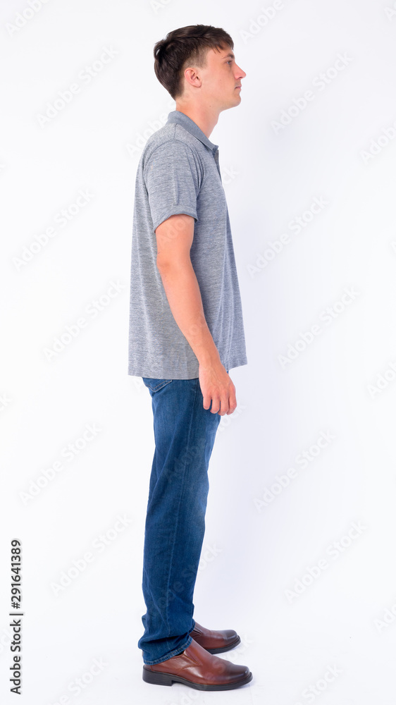Full body shot profile view of young handsome man Stock Photo | Adobe Stock