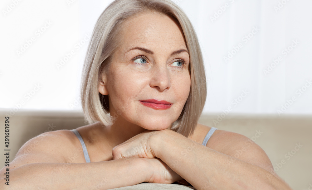 Beautiful middle-aged blonde woman shows off her perfectly well-groomed ...