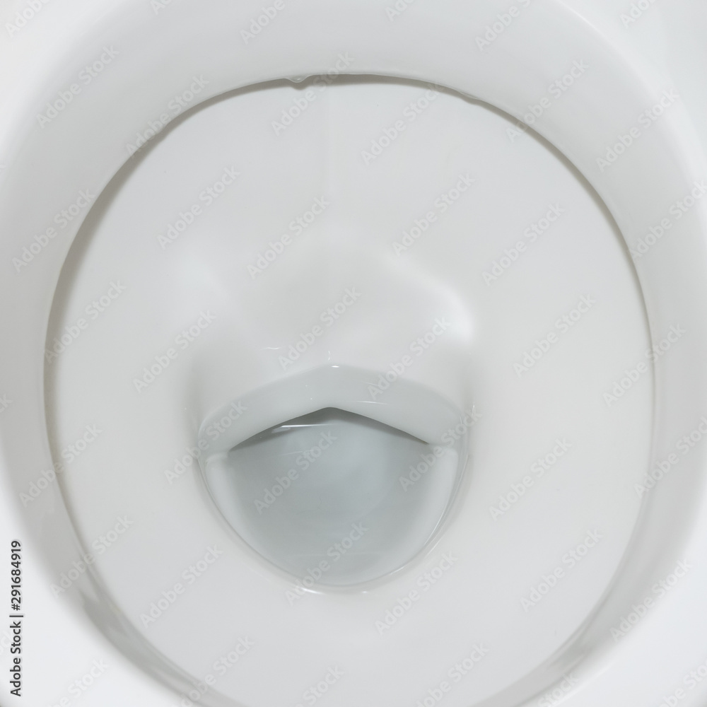 Toilet close-up. White ceramic toilet bowl. Stock Photo | Adobe Stock