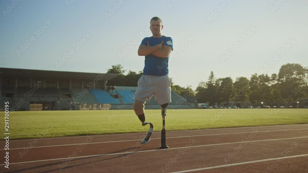 Athletic Disabled Fit Man with Prosthetic Running Blades is Posing with ...
